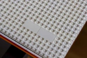 Glass Top Dining Table with Lego Parts Offers Unique Furniture Design Idea