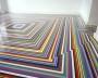 Modern Floor Decoration with Tape Strips Creating Cool Rainbow Design