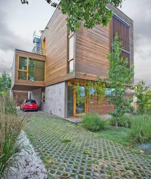 Modern House Design with Warm Wooden Interiors and Modernist Feel