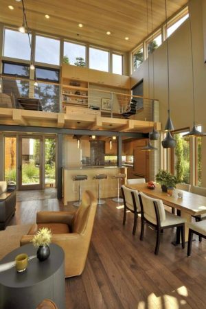 Beautiful Lakefront House with Large Windows Surrounded by Gorgeous Trees