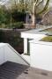 Floating Home with Creative Window Designs and Bright Modern Interiors