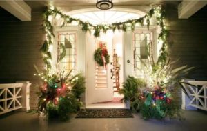 Outdoor Christmas Decorating with Green Garlands and Winter Holiday Wreaths